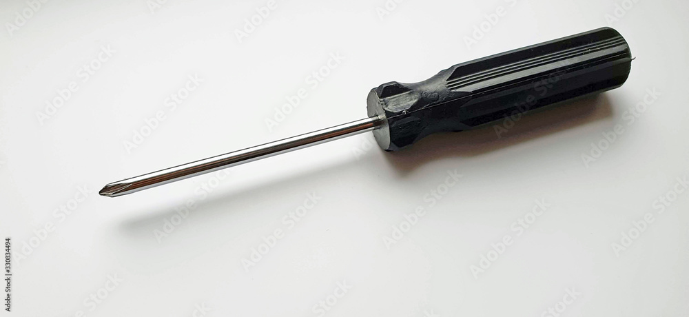 cross head screwdriver with black plastic handle in classic shape ...