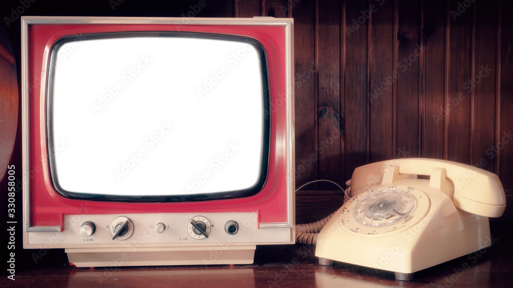 Two vintage objects from the past, inside a living room: a television ...