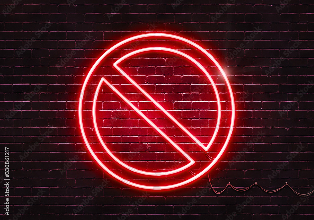 Neon sign on a brick wall in the shape of a forbidden symbol ...