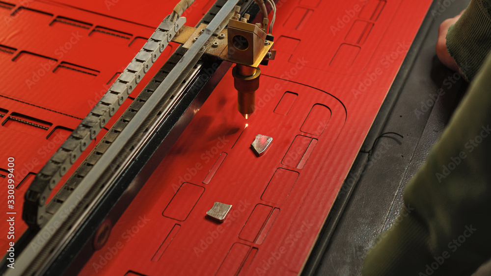 Fotografia do Stock: Laser cutting beam high precision on a paperboard ...