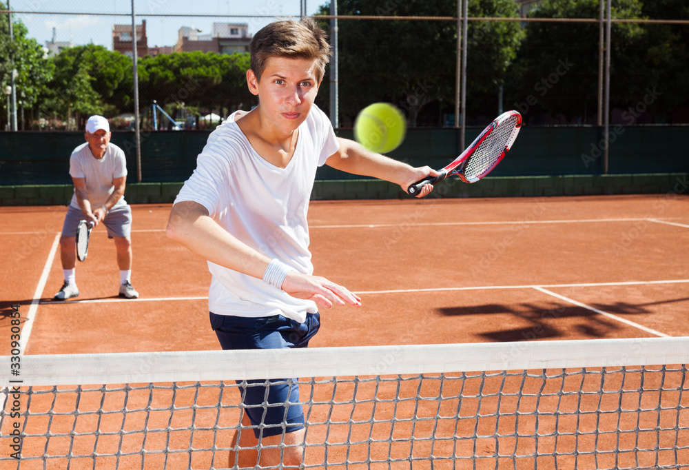 tennis players of different generations playing tennis court Stock ...