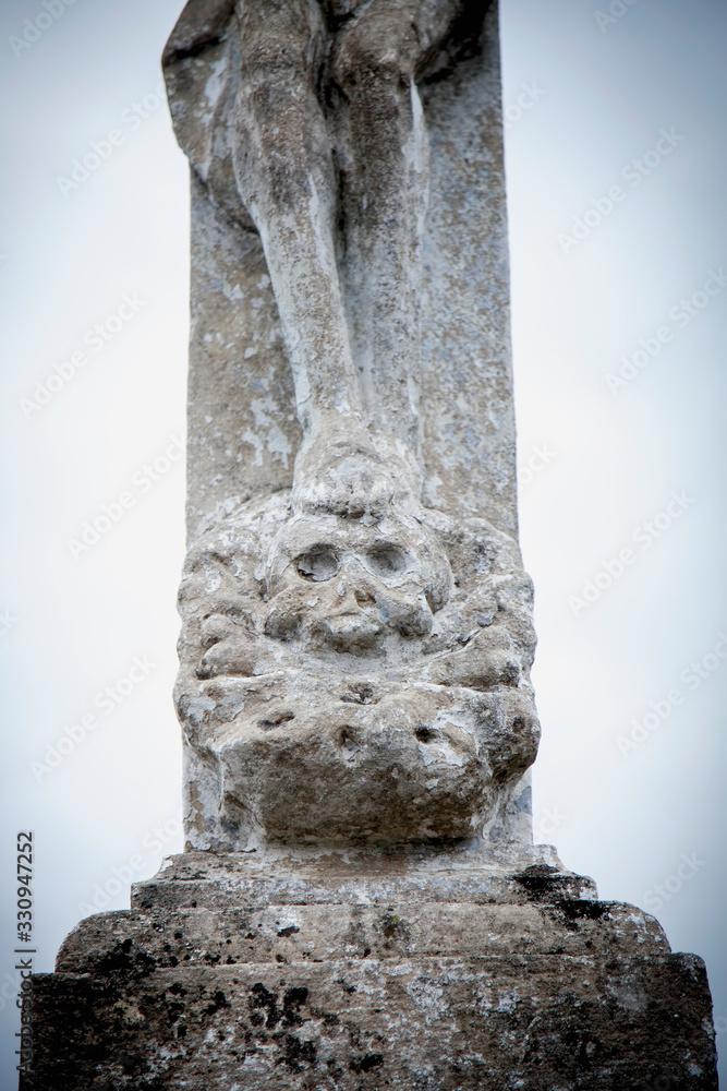 Fragment of very ancient statue of skull of first man Adam was buried ...
