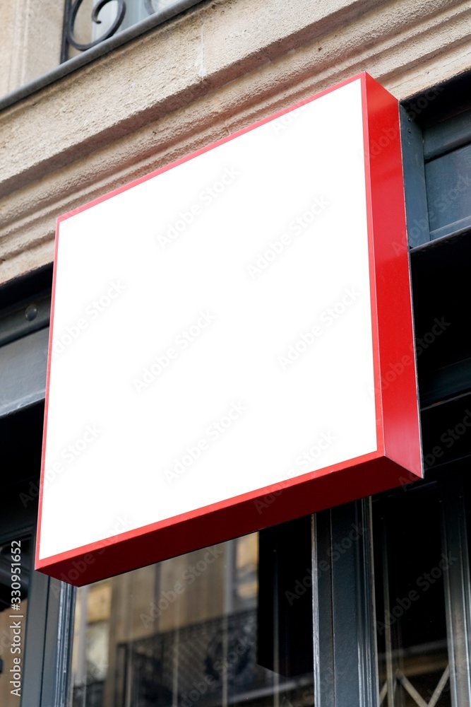 empty white red poster frame on store glass of showcase window of ...