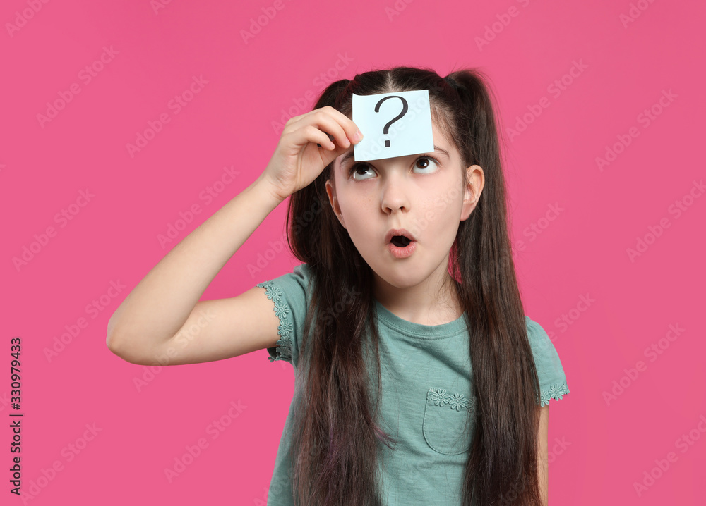 Emotional girl with question mark sticker on forehead against pink ...