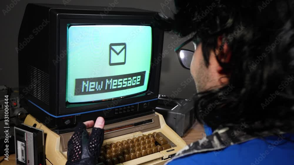 Vintage computer nerd excited about receiving a new message on a retro ...
