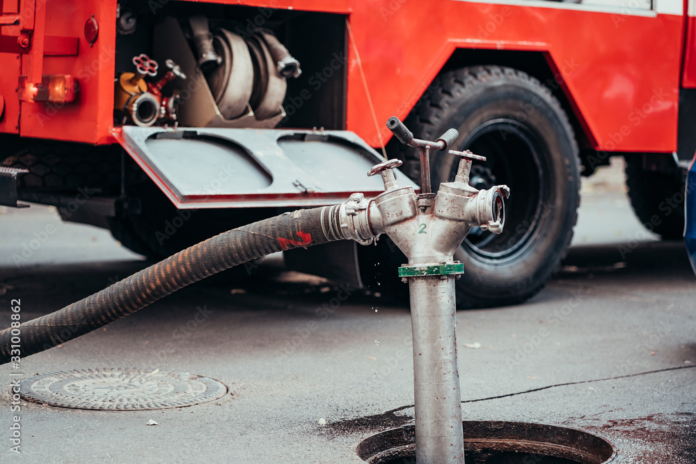 Fire Hydrant In Use During a Structure Fire Stock Photo | Adobe Stock