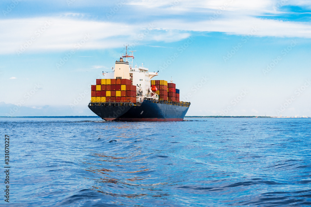 Large cargo container ship leaving the port of Norfolk, close-up ...