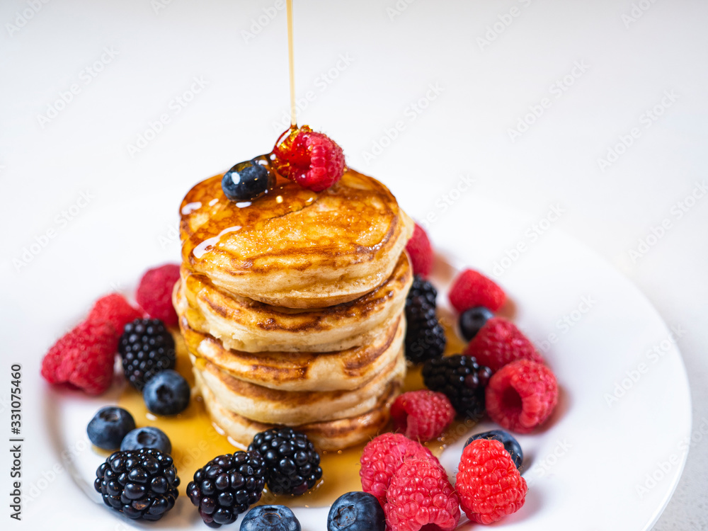 Pancakes for breakfast with raspberries and maple syrup. Fluffy and ...
