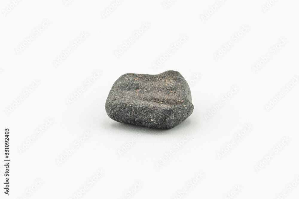 Black magnetic Atacaimite Tektite Meteorite isolated, a rock formed in ...