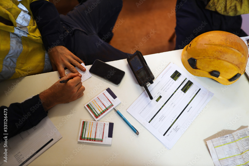 Work safe practise top view of construction workers setting on the ...