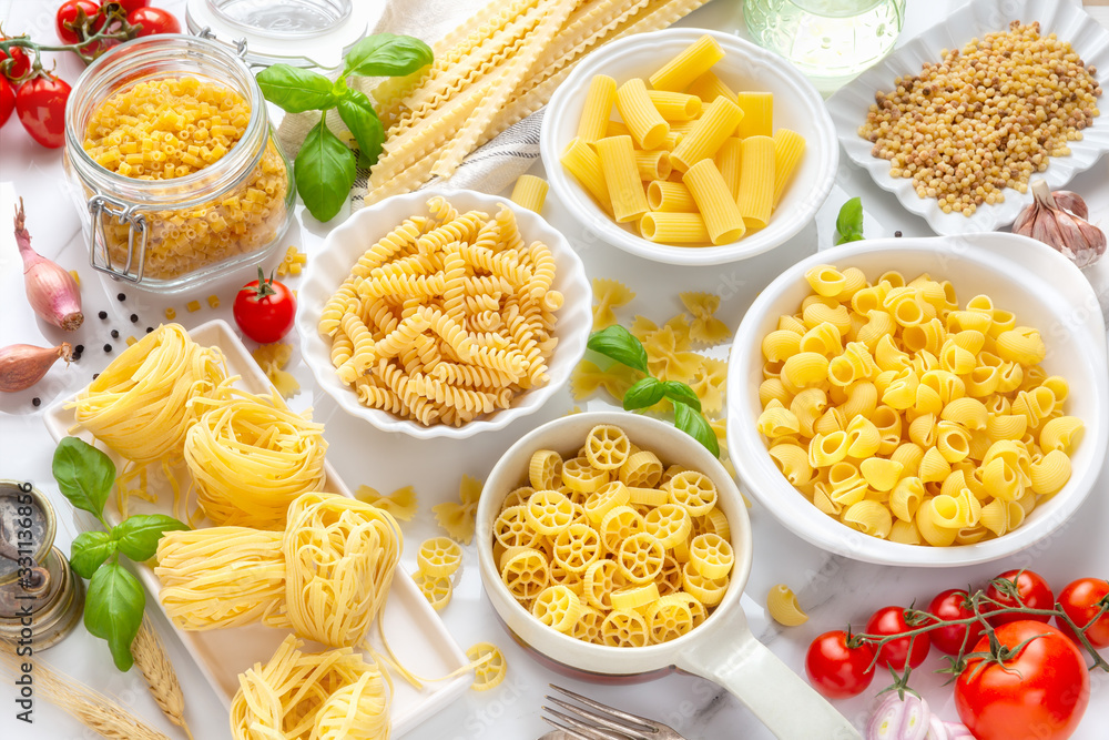 Variety Of Types And Shapes Of Dry Pasta Fusilli Penne Fettuccine variety-of-types-and-shapes-of-dry-pasta-fusilli-penne-fettuccine