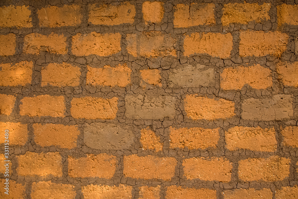 Pattern view of a handmade terracotta brick wall, of a typical tribal ...