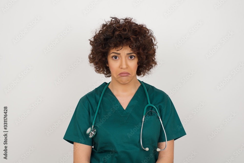 Sad doctor woman crying desperate and depressed with tears on her eyes ...