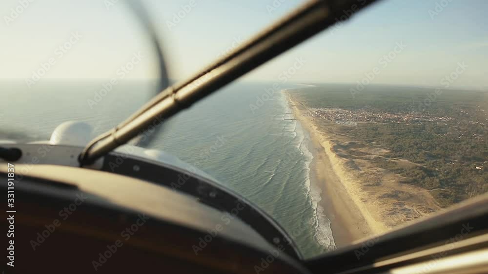 inside view from the cockpit of a flying moving plane flying over a ...