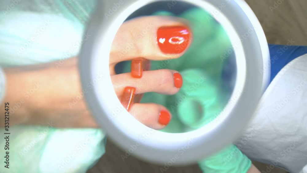 Pedicure master making aesthetic pedicure in a beauty salon. A ...