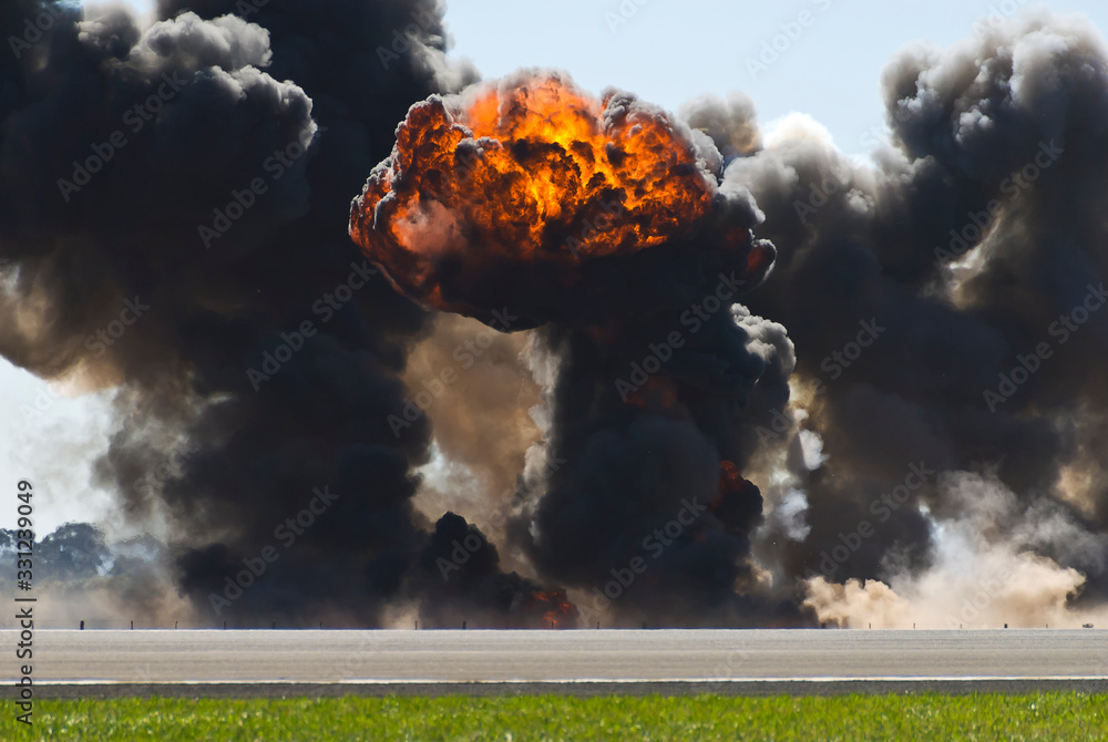 Firey explosion with thick black smoke on an airport runway. Stock ...