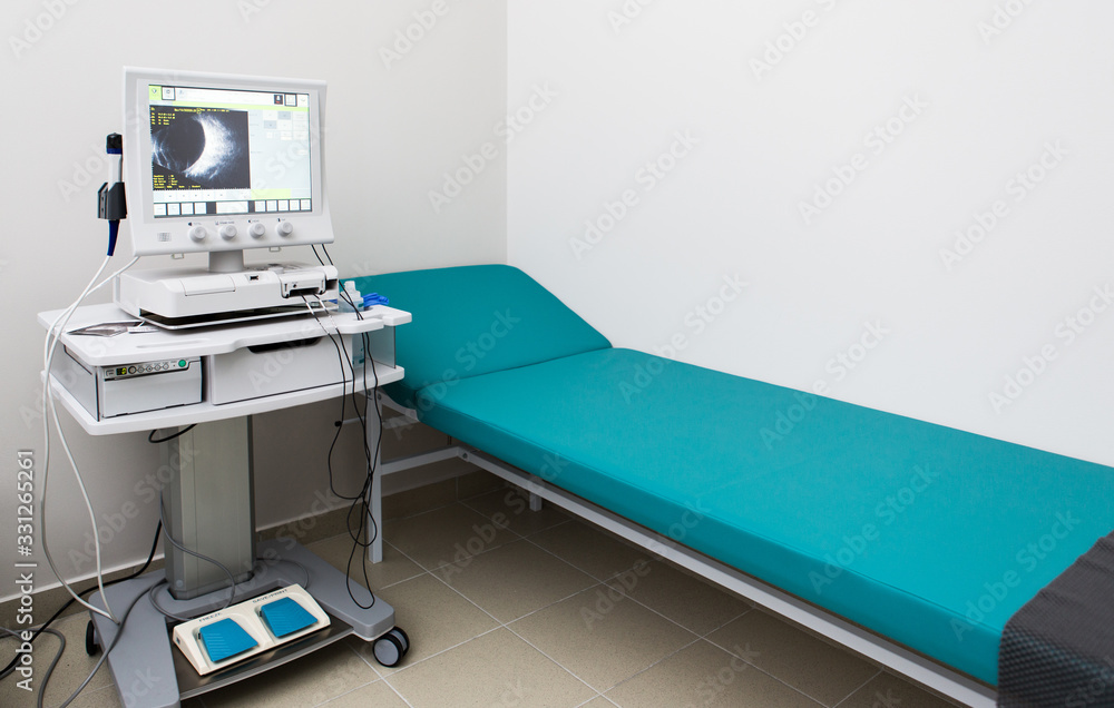 Interior of hospital room with ultrasound machine and bed Stock Photo ...