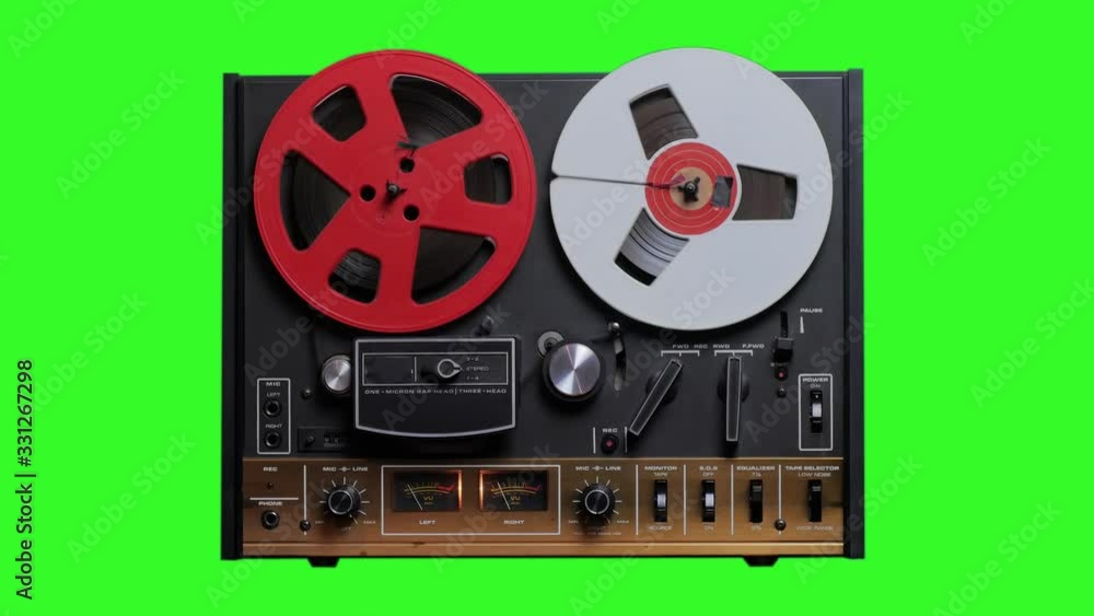 Retro reel to reel tape machine rolling with green screen to use it on ...
