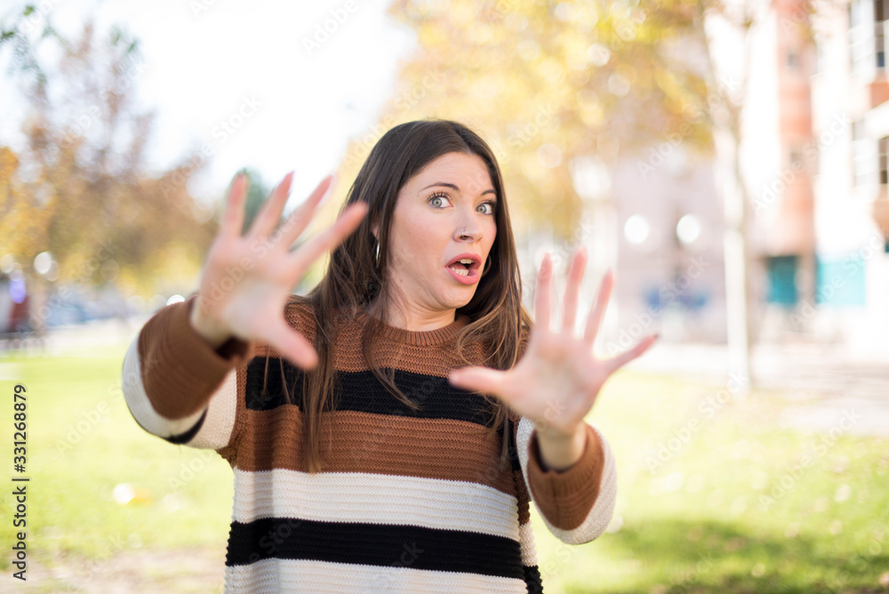 Dissatisfied female model frowns face, has disgusting expression, shows ...