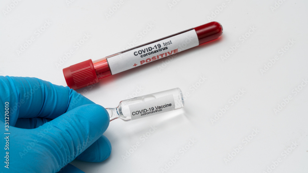 Doctor holds COVID 19 Coronavirus vaccine in his hand, infected blood ...