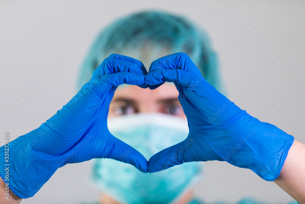 Young woman doctor wearing protective mask against coronavirus. Doctor ...
