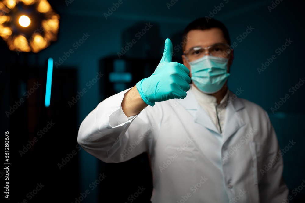 Attractive young Pharmaceutical researcher showing thump up for ...