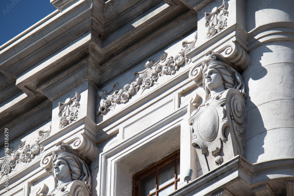 Stone face sculpture on building facade Stock Photo | Adobe Stock