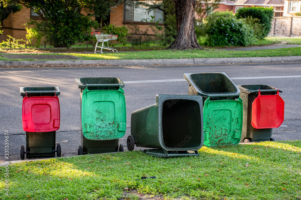 Australian Garbage Wheelie Bins Staying And Laying On A Kurb Side After Council Colleciton
