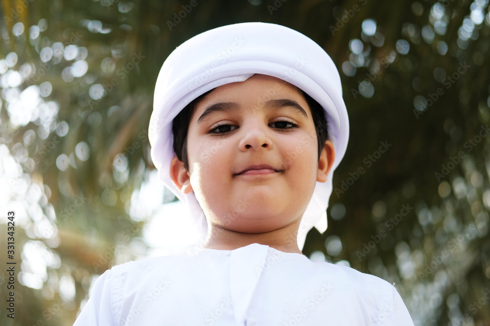Arab Emirati boy student portrait wearing traditional middle eastern ...