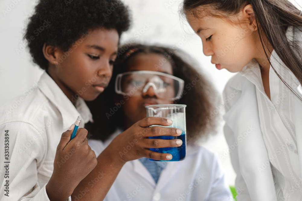 Group of teenage cute little students child learning research and doing ...