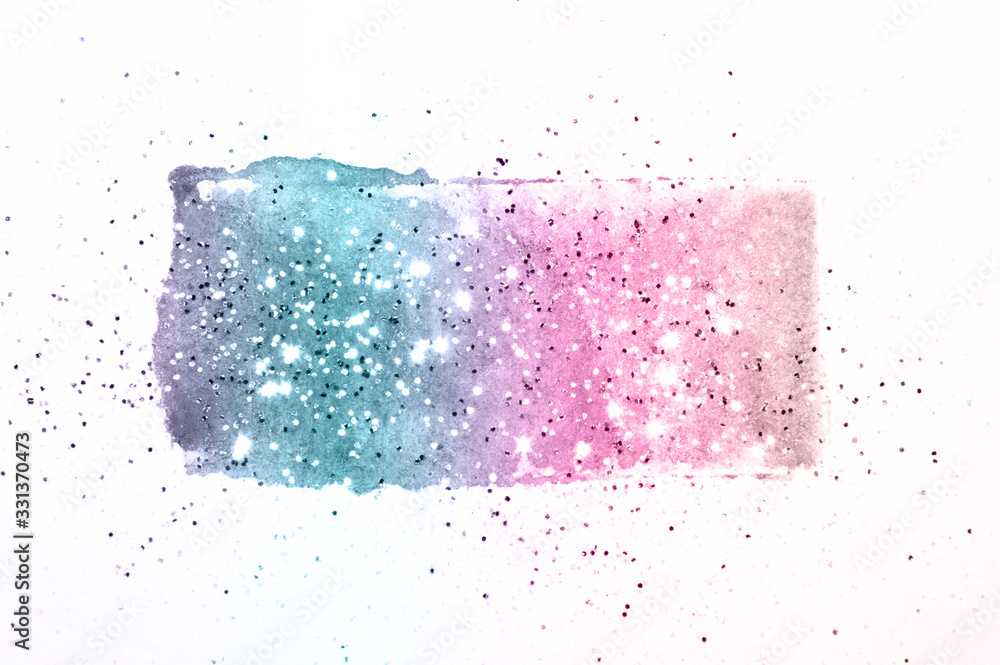 Golden glitter on abstract pink and blue watercolor splash on white ...
