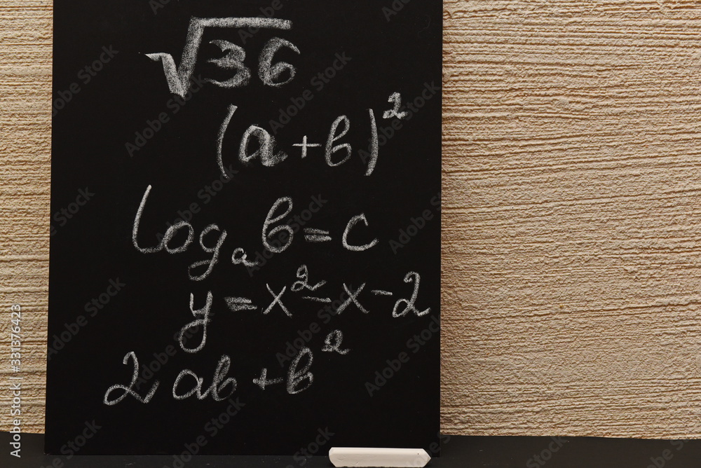 chalk image on the blackboard of mathematical formulas for solving ...