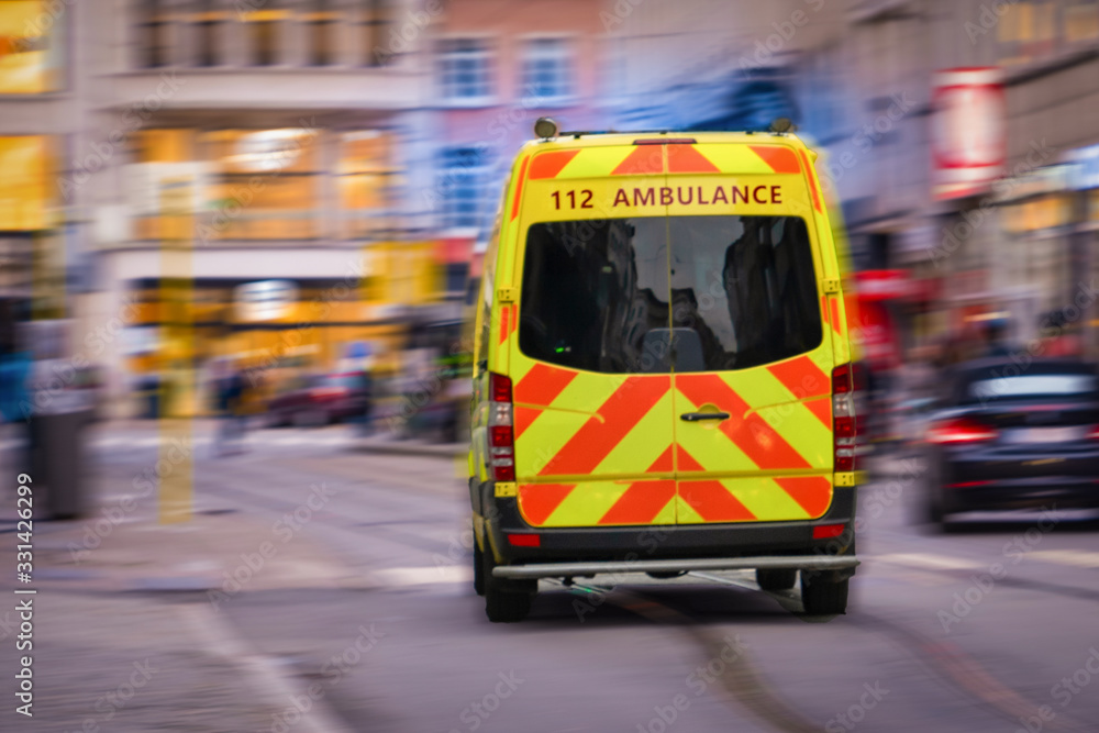 Back view of emergency ambulance car in a blurred street Stock Photo ...