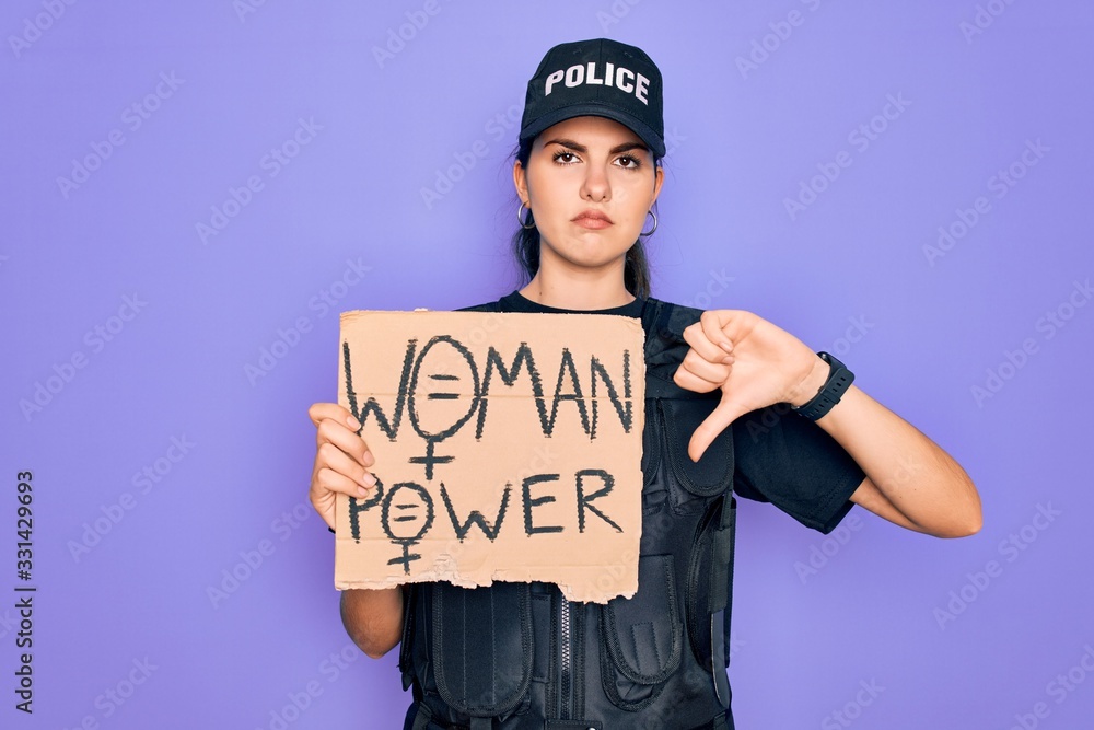 Police woman wearing security bulletproof vest uniform holding woman ...