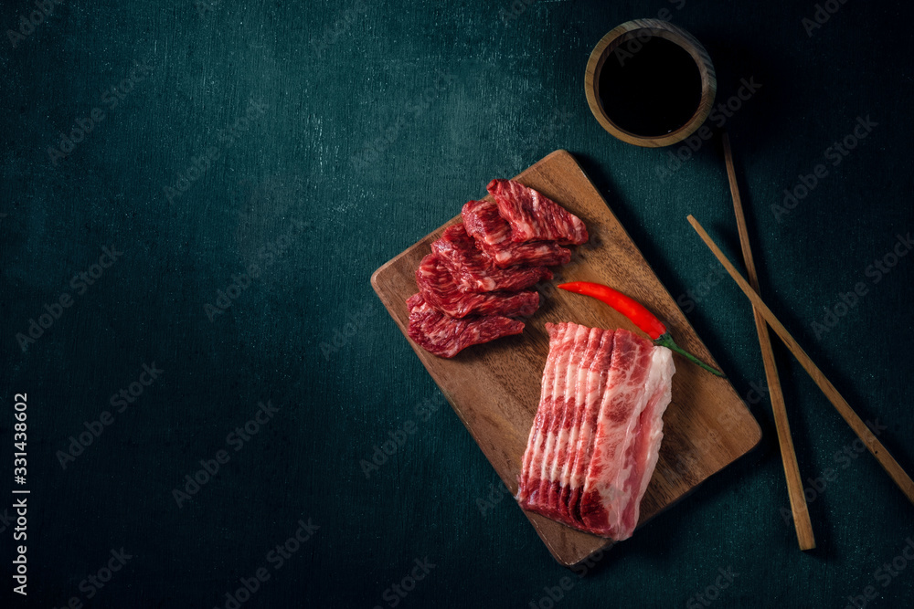 Sliced marble Wagyu beef for yakiniku or shabu shabu on a Board on a ...
