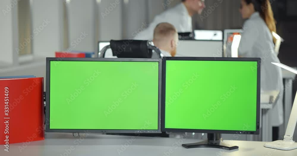 Green screen monitors in busy engineering department office Stock Video ...