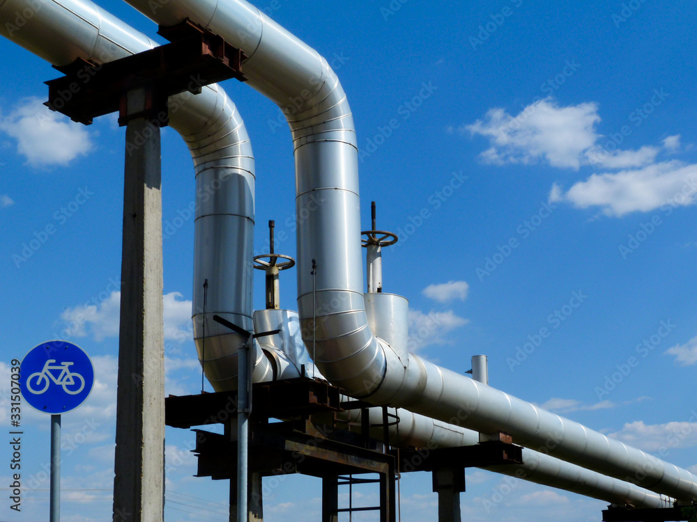 overhead gas or heating pipeline. aluminum shroud covered supply tubes ...