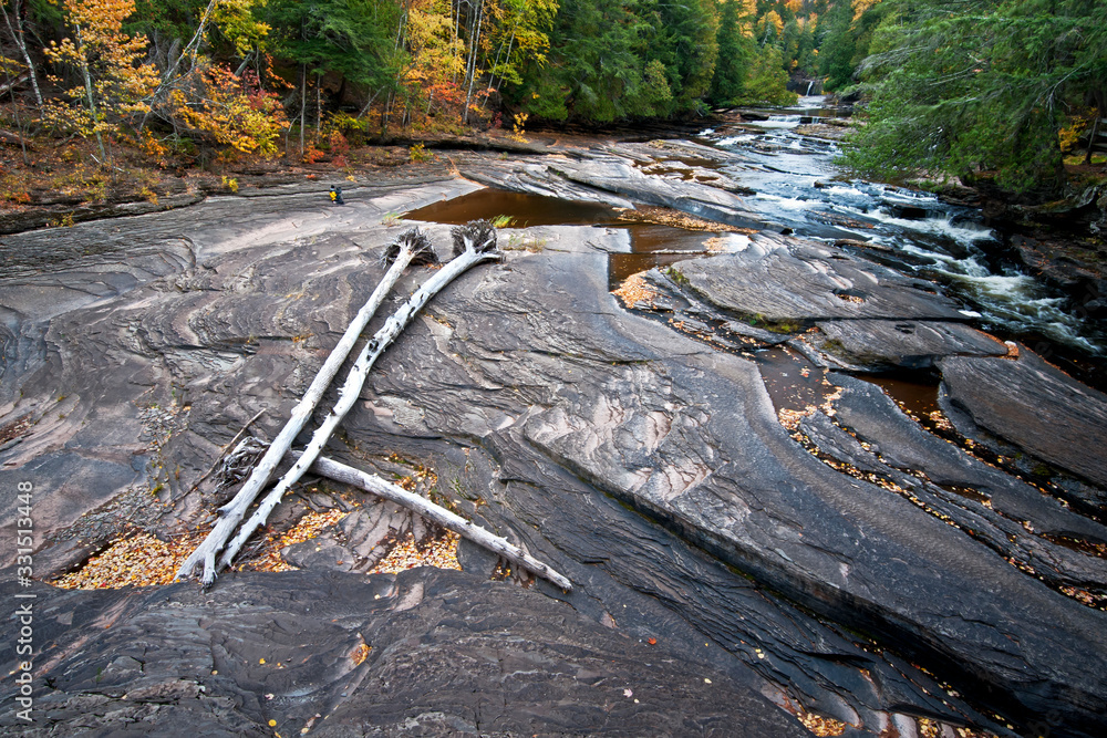 Low water levels on the Presque Isle River where it flow through the ...