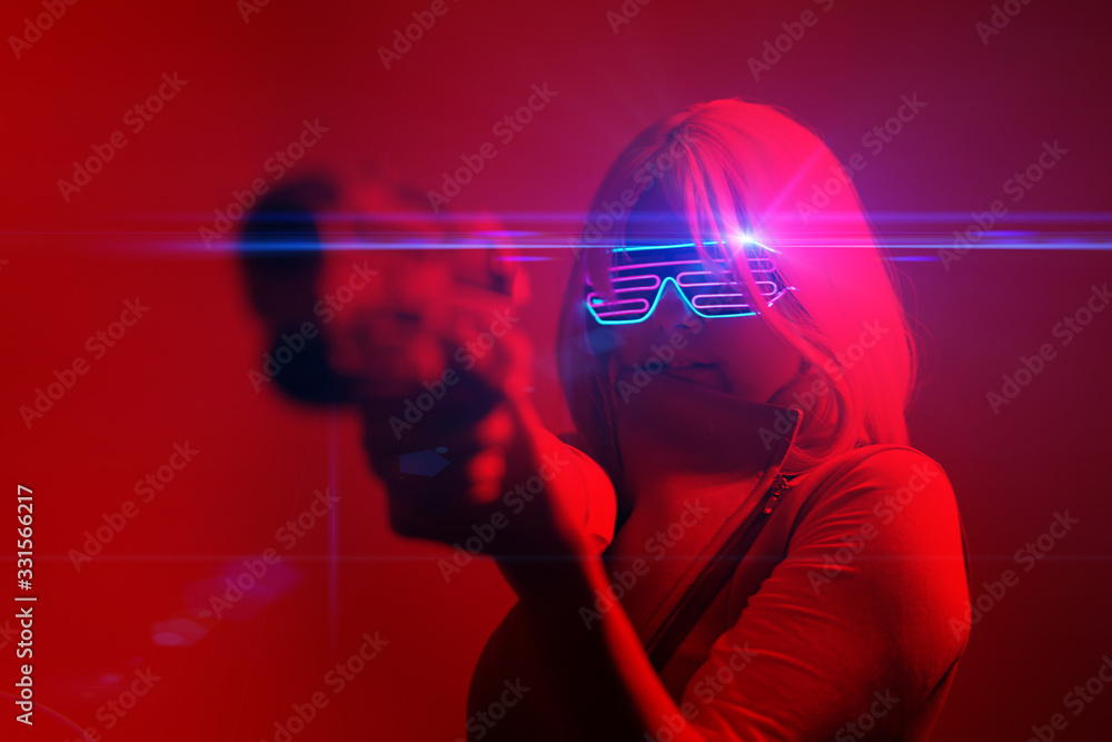 Girl with blaster in the futuristic battle. Concept virtual reality ...