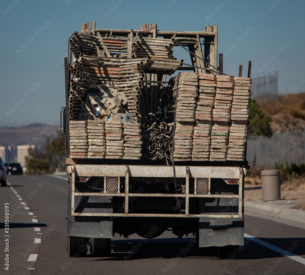 Scaffolding materials including metal frame and planks loaded on ...