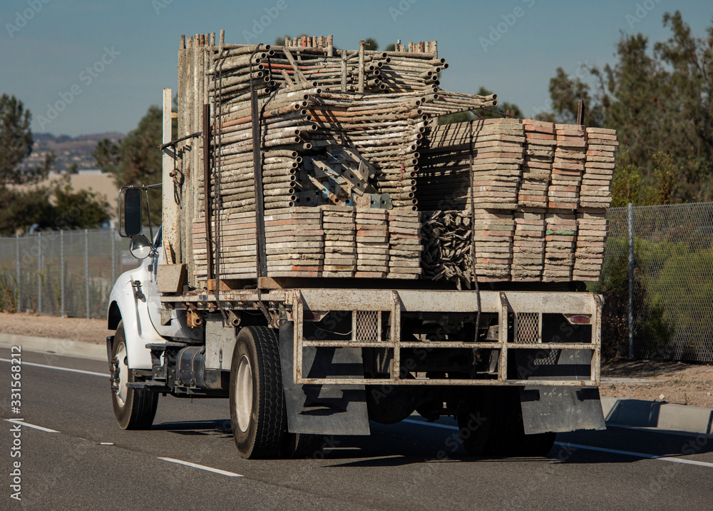 Scaffolding materials including metal frame and planks loaded on ...