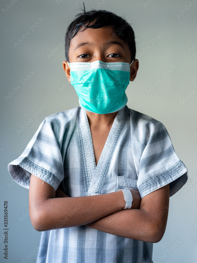 Young Muslim Boy wearing a mask. Covid-19 coronavirus concept. Shallow ...