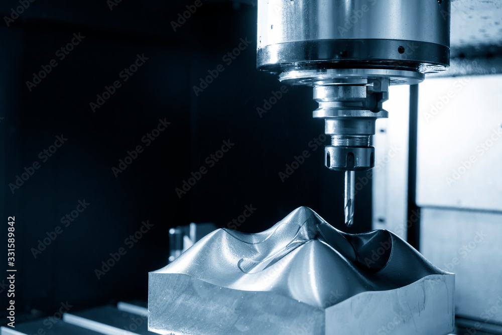 The CNC milling machine finishing cutting the injection mold parts by ...