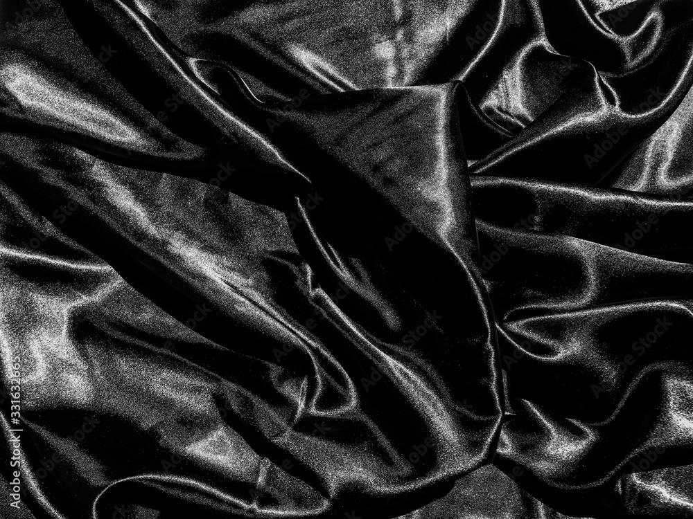 Black satin texture background with liquid wave or wavy folds ...