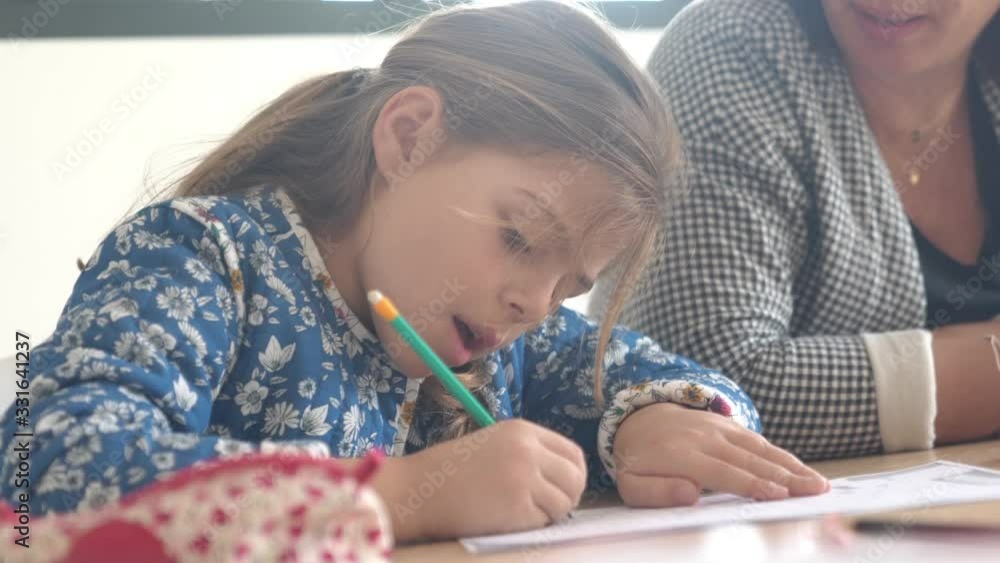 little girl doing her lessons at home Stock Video | Adobe Stock