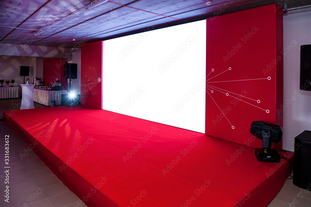 Conference room with a red stage and chairs Stock Photo | Adobe Stock