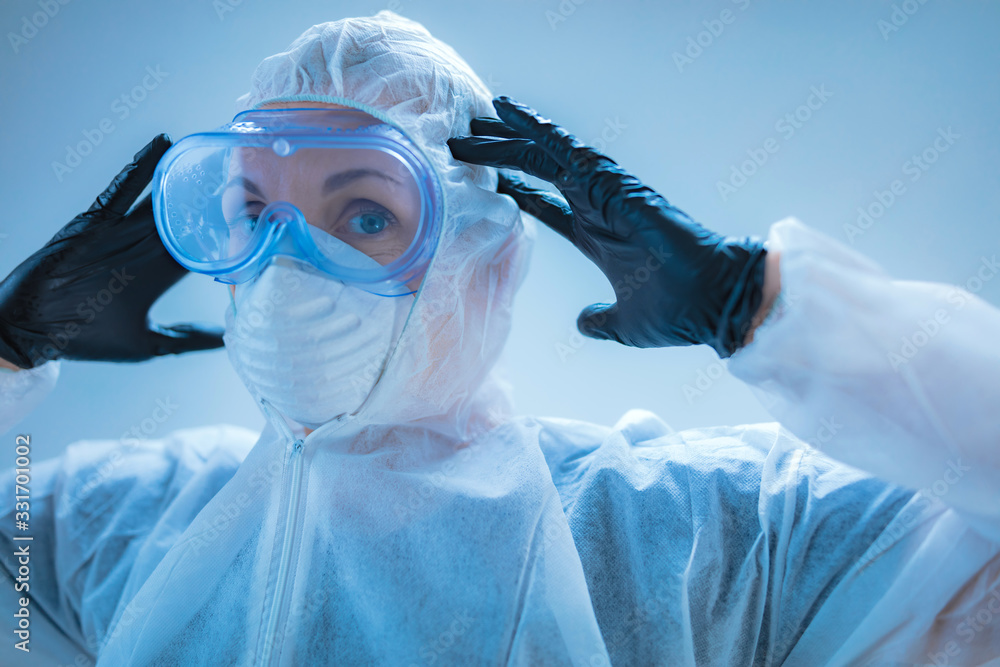 Medical doctor, scientist in full body suit for prevention from viruses ...