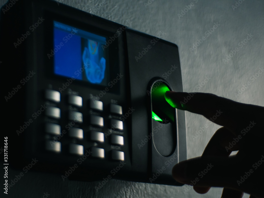 Foto de Finger scan on machine Security concept and safety. soft focus ...