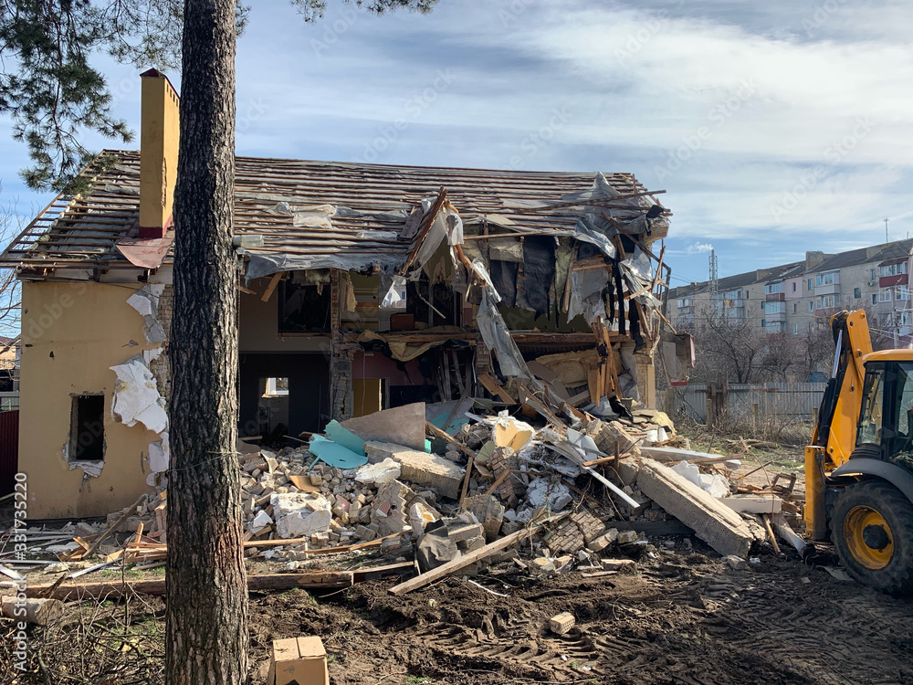 Ruined, brick, residential building. The ruins of a collapsed mansion ...