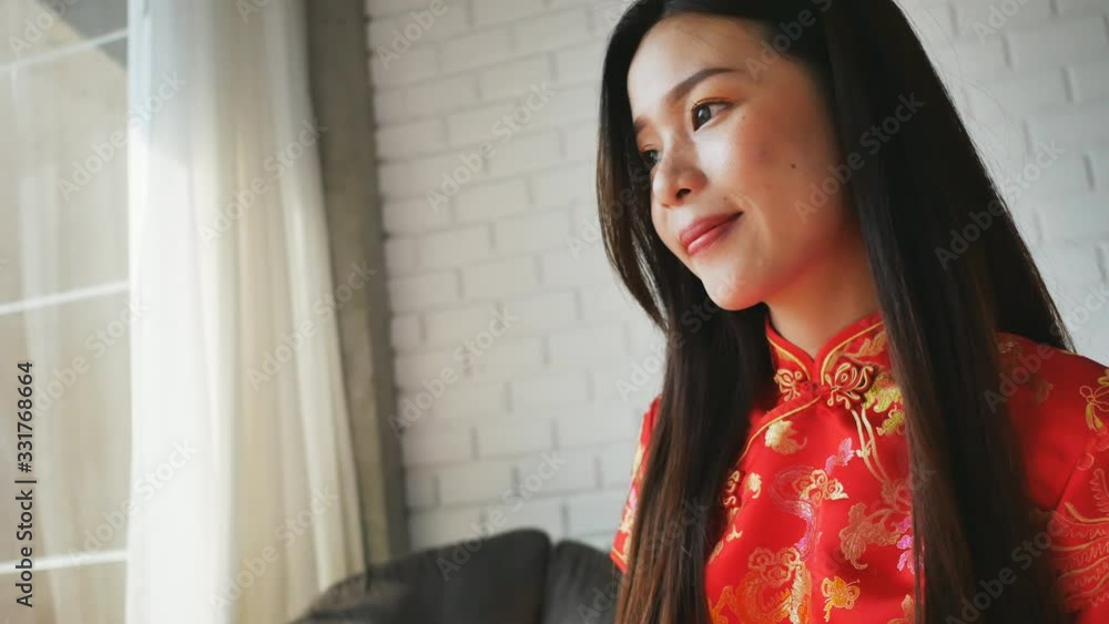 Portrait video of Cute Chinese lady wearing red Cheongsam Stock Video ...